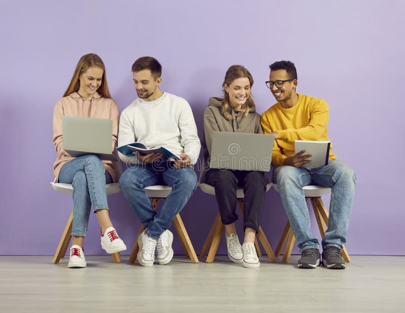 Portrait of Group of Happy Graduates in Academic Mantles Holding ...