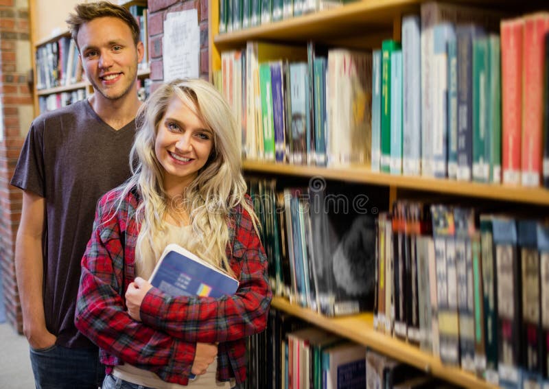 Students Standing by Bookshelf in the Library Stock Image - Image of ...