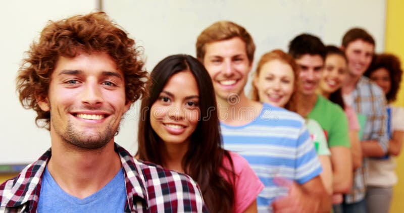 Students Sitting in a Line Taking Notes in Classroom Stock Footage ...