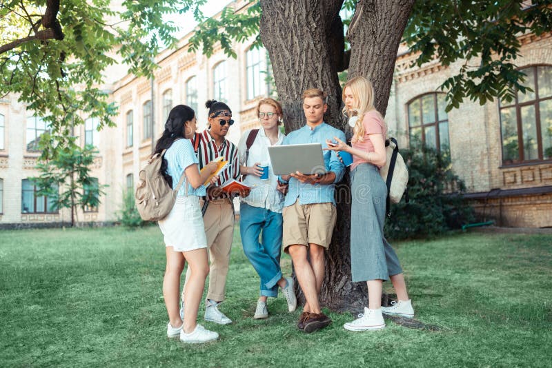 Students Standing Uner the Big Tree during Break. Stock Image - Image ...