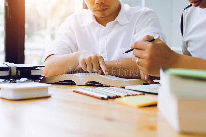 Students Study Together at the University Library. Stock Photo - Image ...