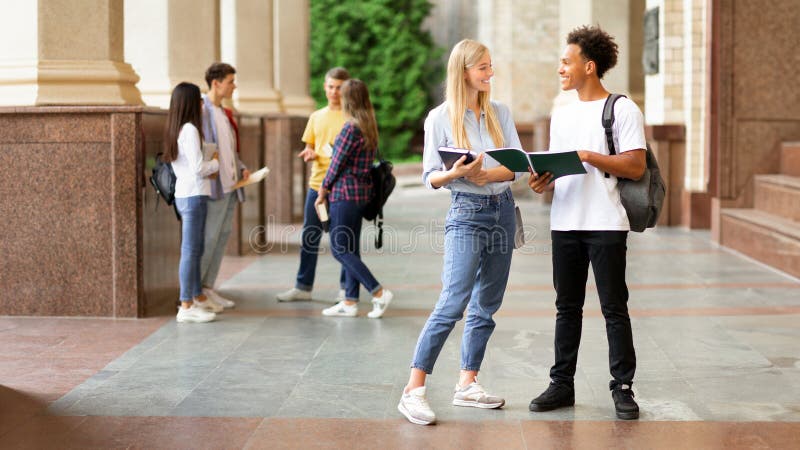 Students Studying with Books in University Campus Stock Image - Image ...