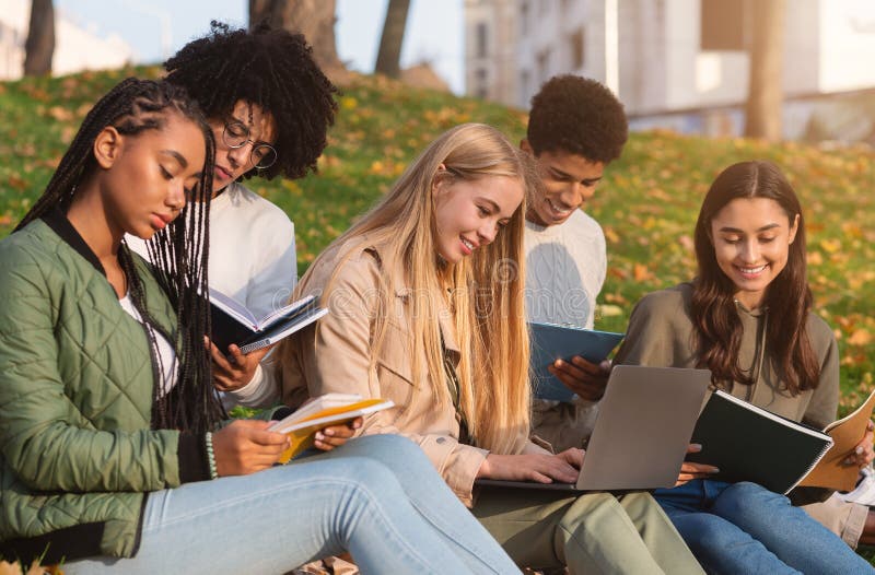 Students Studying Hard, Sitting on the Ground at Park Stock Photo ...
