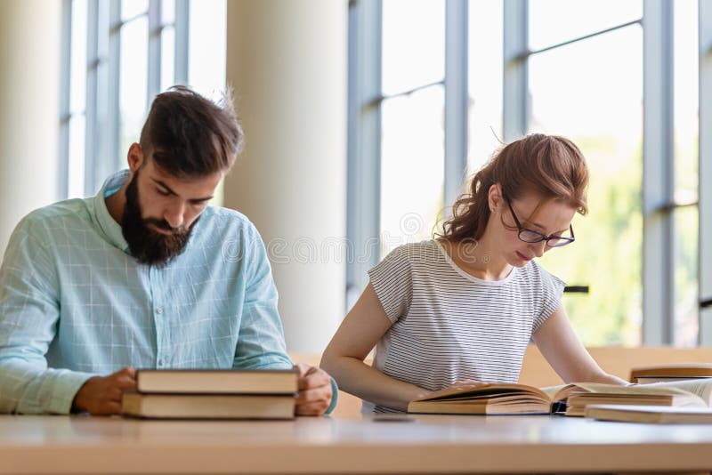 Students Studying in Library. Young Success People are Spending Time ...