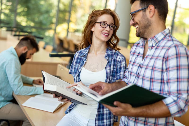 Students Studying in Library. Young Success People are Spending Time ...