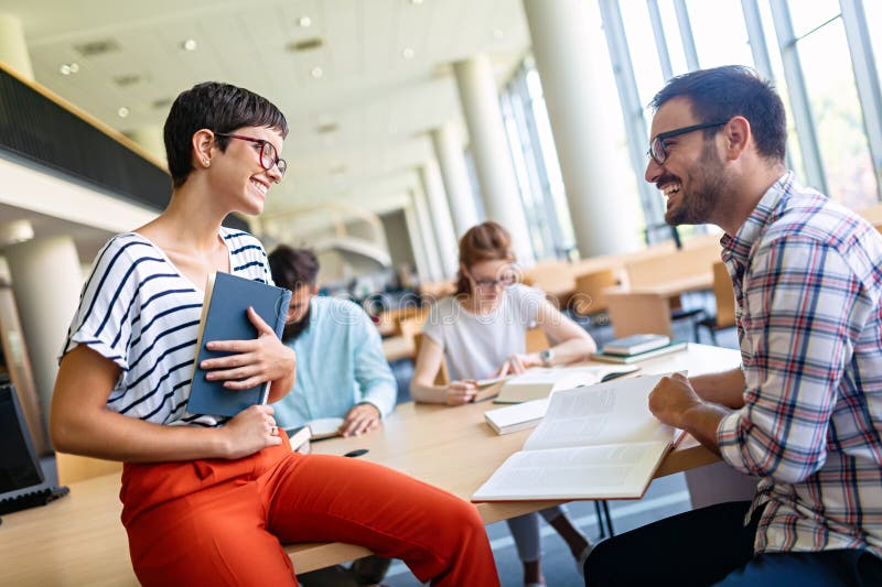 Students Studying in Library. Young Success People are Spending Time ...