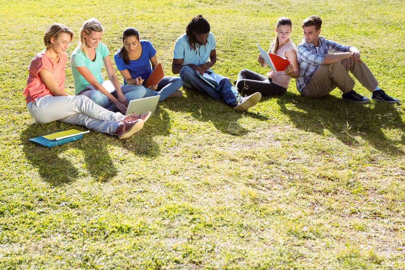 Students Studying Outside on Campus Stock Photo - Image of male, lawn ...