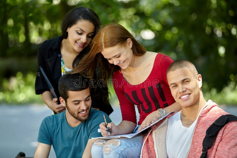 Students studying outside stock photo. Image of college - 57365398