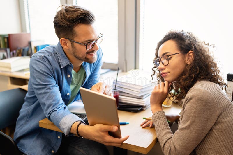 Library - Couple Studying stock image. Image of female - 41980601