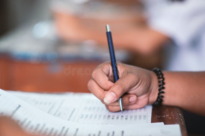 Students Taking Exam Answer Sheets Exercises in Classroom of School ...