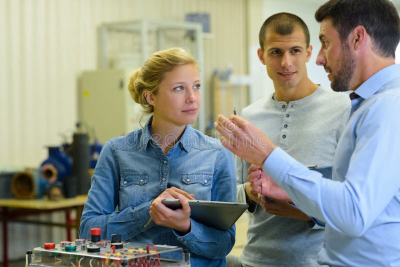 Students Taking Notes in Engineering Laboratory Stock Image - Image of ...
