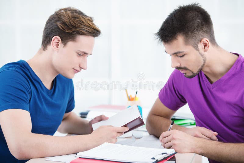 Students Taking Notes and Reading in Classroom Stock Photo - Image of ...