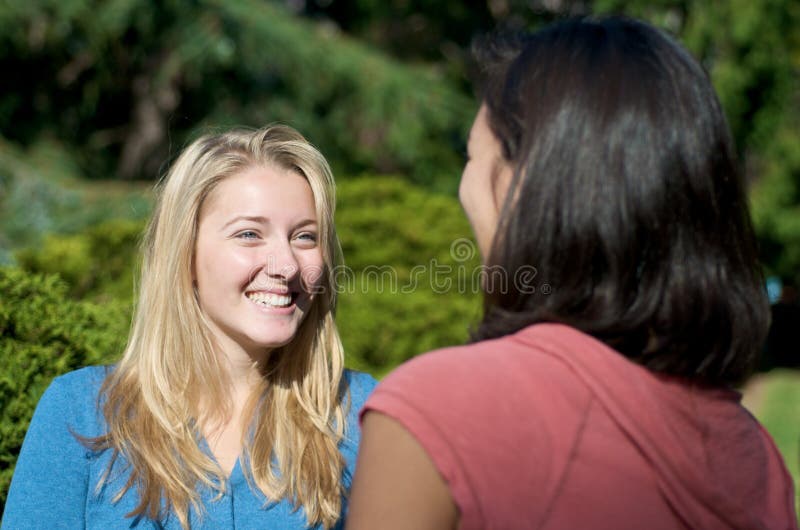Hispanic friends talking stock photo. Image of friendship - 9197720