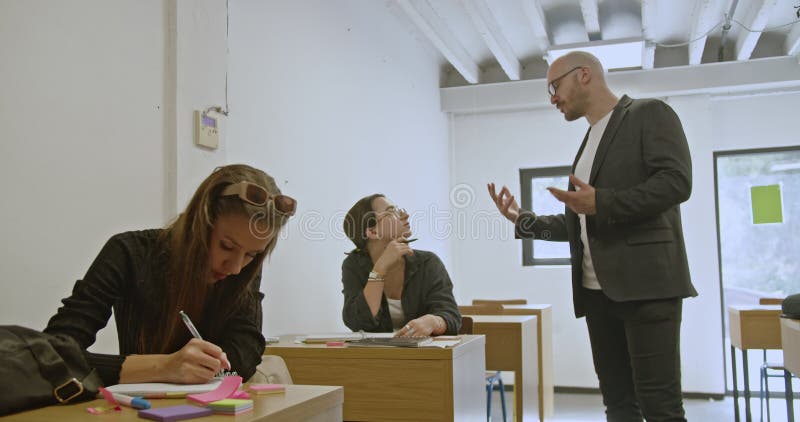 Students and Teacher Collaborating in High School Class: Learning ...