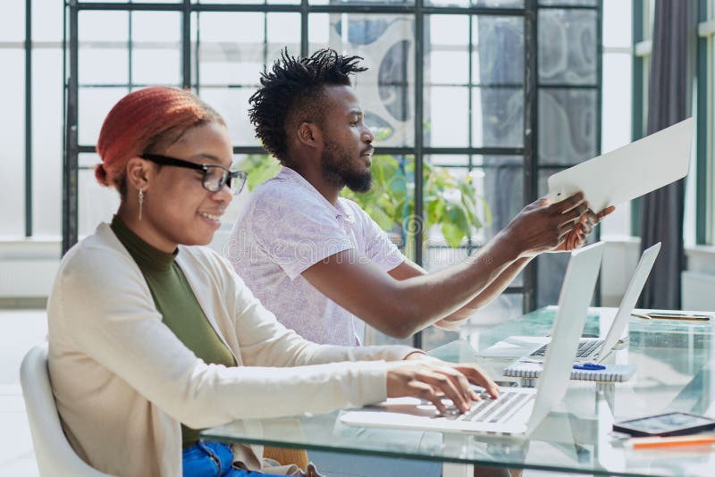 A Group of Young Students are Being Trained on a Computer in a Training ...