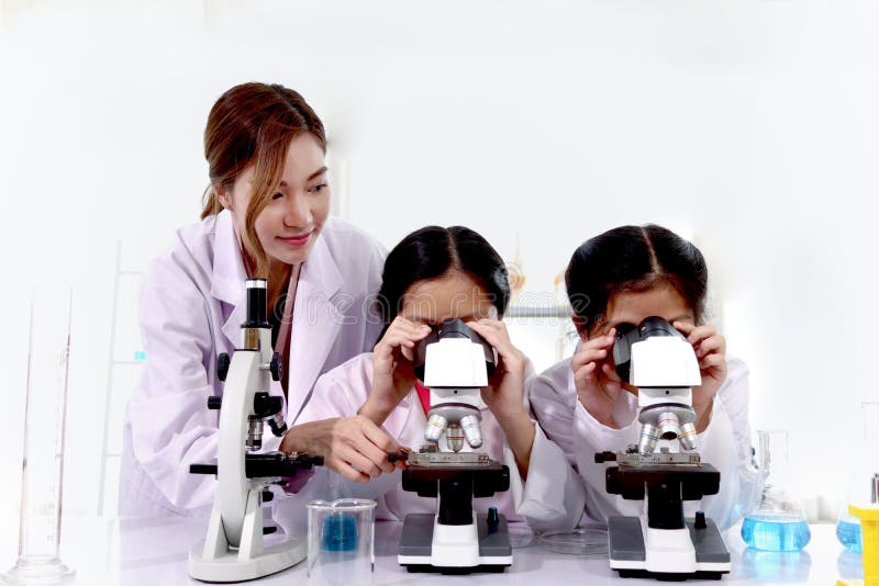 Students and Teacher in Lab Coat Have Fun Together while Learn Science ...