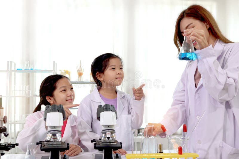 Students and Teacher in Lab Coat Have Fun Together while Learn Science ...