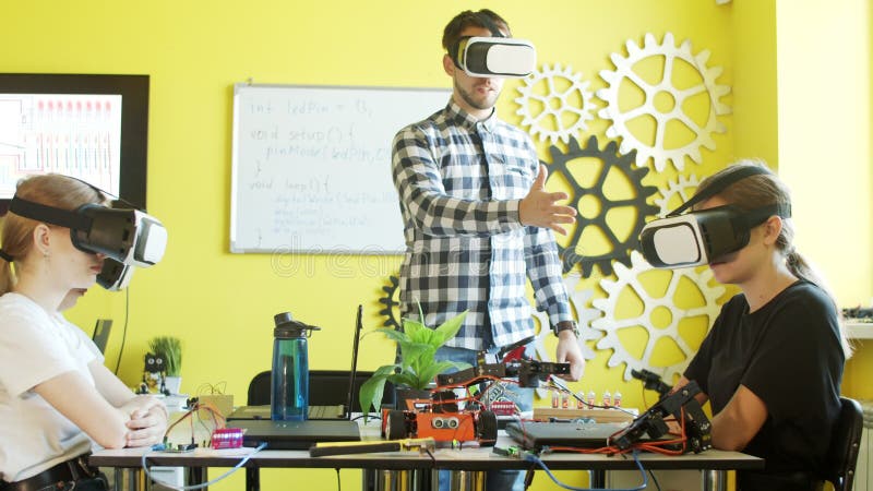 Students and Teacher Using VR Goggles in Classroom Stock Video - Video ...