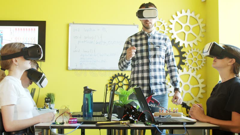 Students and Teacher Using VR Goggles in Classroom Stock Video - Video ...