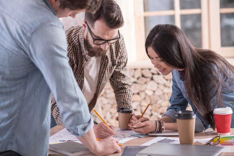 Joyful Nice Students Working on a Project Stock Photo - Image of ...