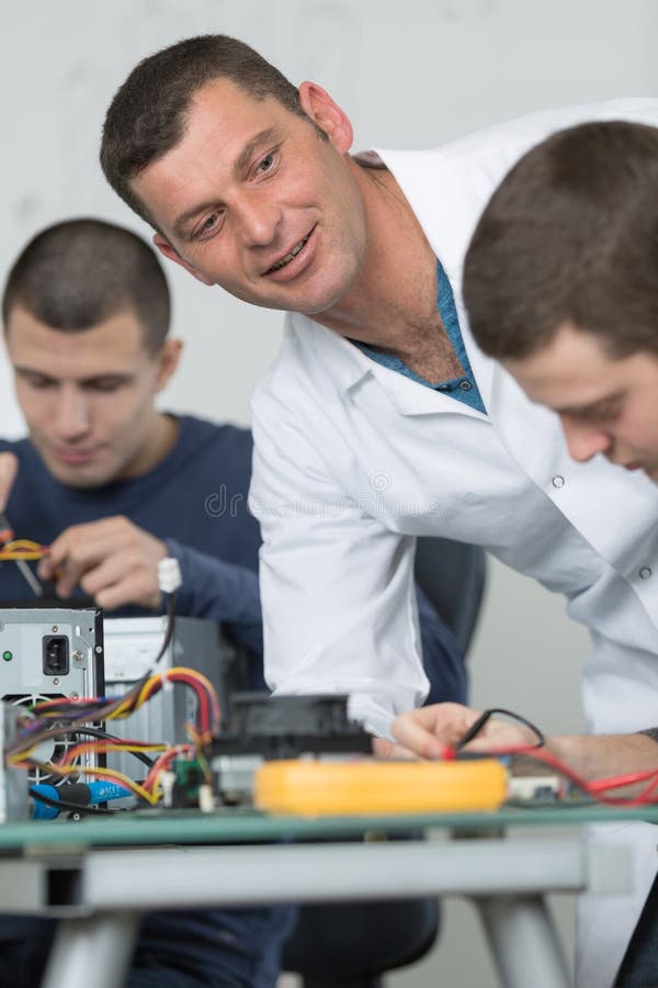 Students in Technology Fixing Computer Processing Stock Image - Image ...