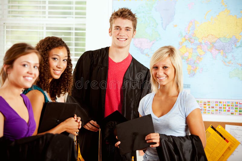 Students: Teens in Class with Graduation Caps and Gowns Stock Photo ...