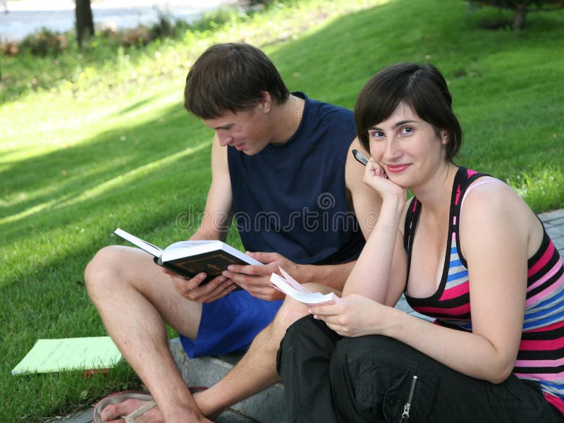 Students with textbooks stock photo. Image of grass, students - 10201904