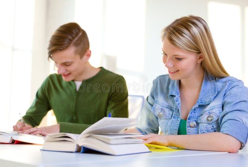 Students with Textbooks and Books at School Stock Photo - Image of ...
