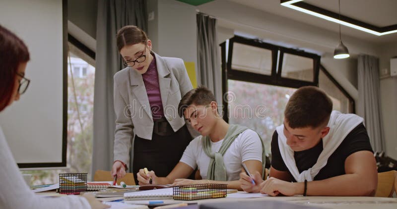 Students Studying with Their Professor after Class for Extra Help and ...