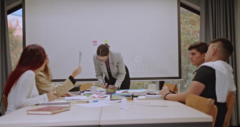 Students and Their Professor Gather during Class for an Exam Review ...