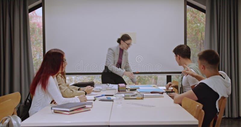 Students Concentrated on Exam with Supervising Professor during Class ...