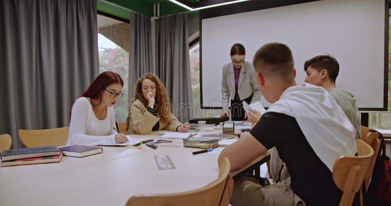 Students and Their Teacher Study Together after Class. they Sit Around ...