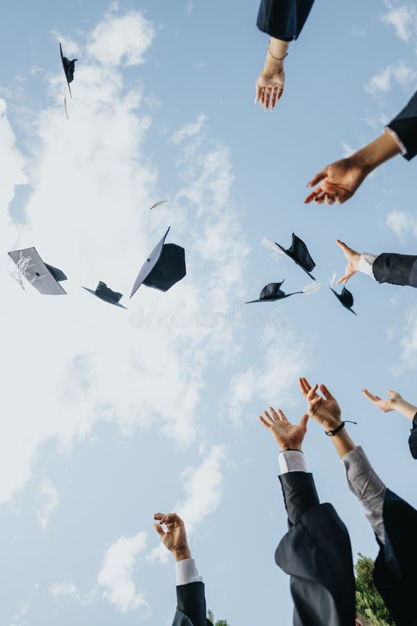Graduates Celebrate Achievements, Wearing Caps and Gowns. they Create ... Graduates Celebrate Achievements, Wearing Caps and Gowns. they Create ...