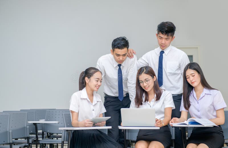 Teenage Students in Uniform Working with Laptop in Classroom Stock ...