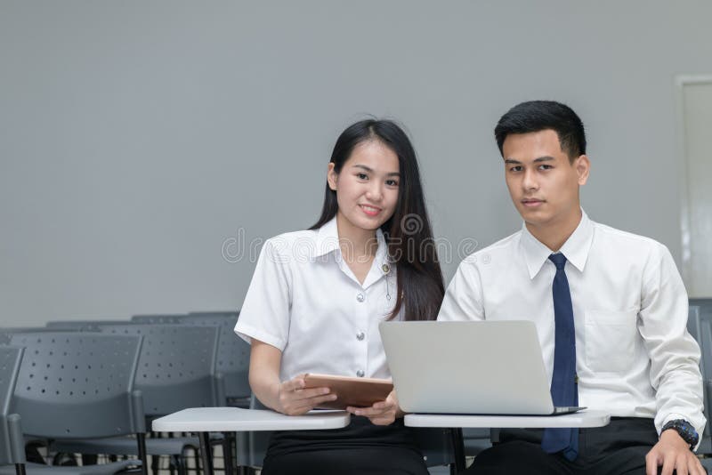 Happy Students in Uniform Working with Laptop Stock Photo - Image of ...