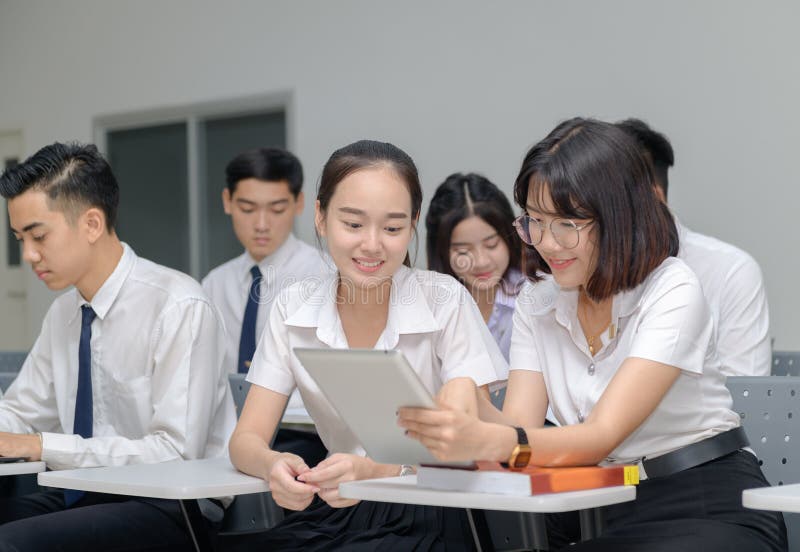 Students in Uniform Working with Tablet Stock Photo - Image of students ...