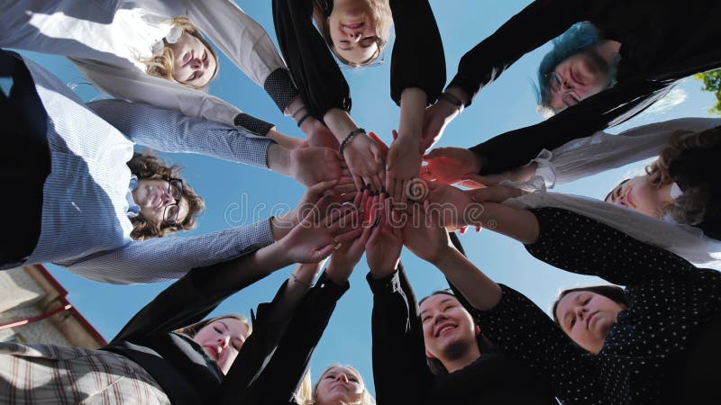 Students Uniting in a Circle To Symbolize Unity and Teamwork on a Sunny ...
