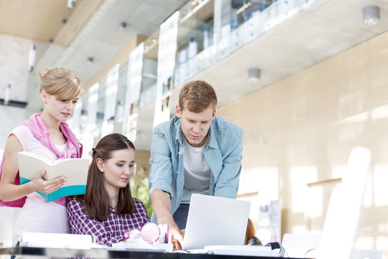 Students Discussing Over Project at Table in University Stock Image ...