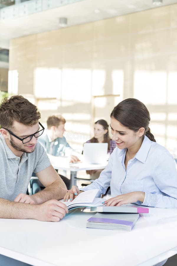 Students Learning Together at Table in University Library Stock Image ...