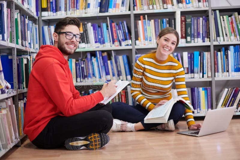 The Students Uses a Notebook, Laptop and a School Library Stock Photo ...