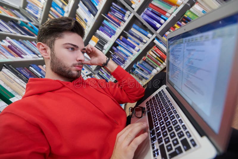 The Students Uses a Notebook, Laptop and a School Library Stock Image ...