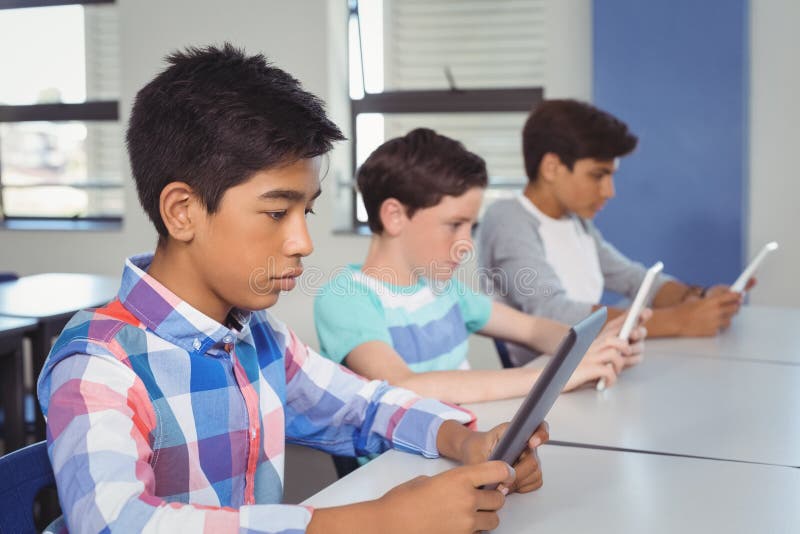 Students Using Digital Tablet in Classroom Stock Photo - Image of ...
