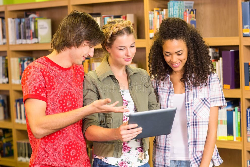 Students Using Digital Tablet in Library Stock Photo - Image of ...