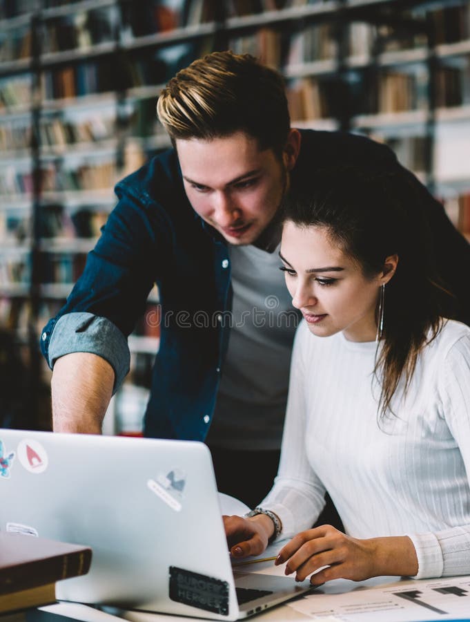 Students Using Laptop for Collaborative Project Stock Image - Image of ...