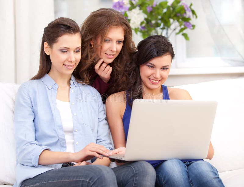 Three girls and a notebook stock photo. Image of cheerful - 42275300