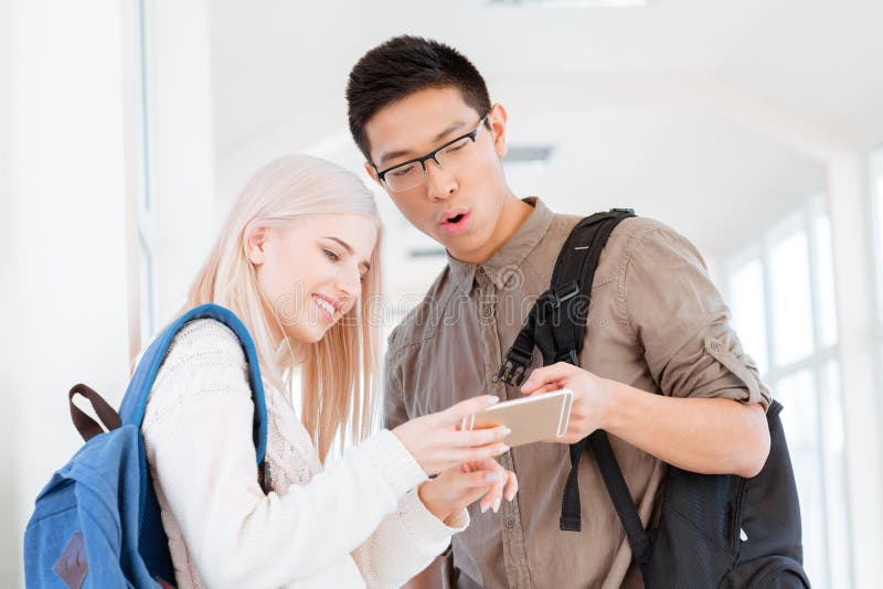 Students Using Smartphone in the University Hall Stock Image - Image of ...