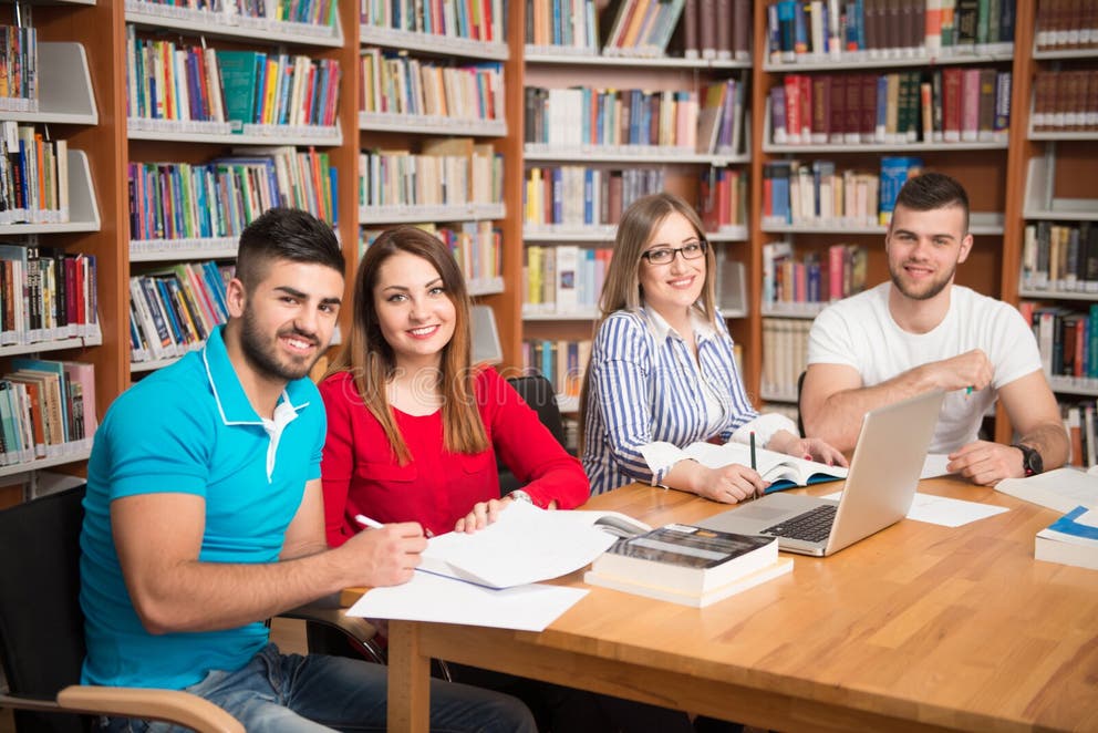 Students Using a Tablet Computer in a Library Stock Image - Image of ...