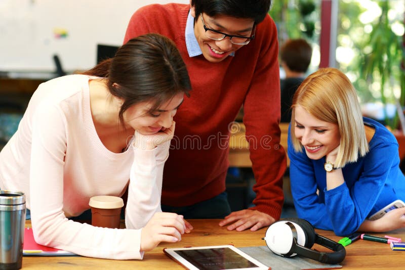 Students Using Tablet Computer Together Stock Photo - Image of happy ...