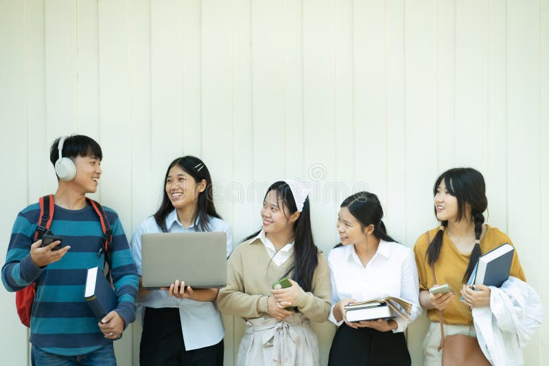 Students Using Technology and Books for Study Stock Photo - Image of ...
