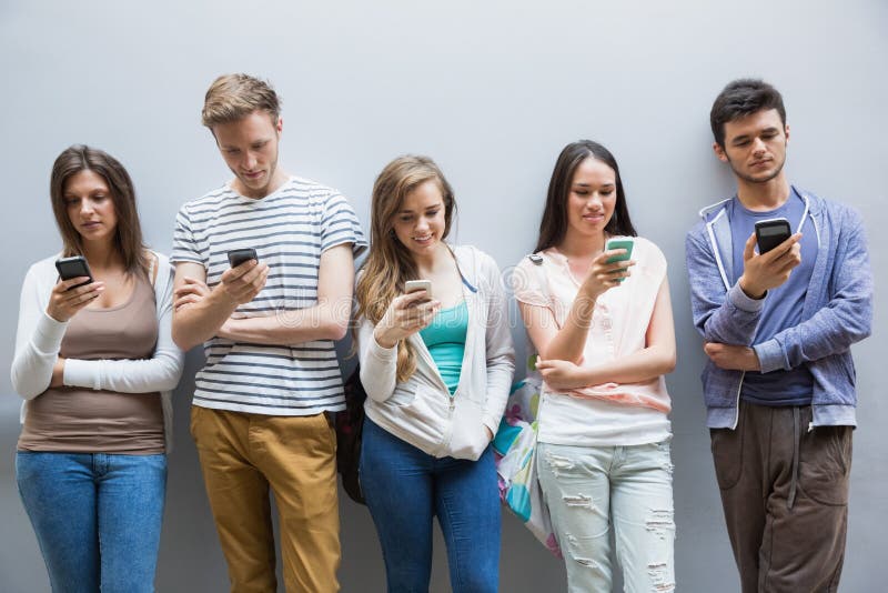 Students Using Their Smartphones in a Row Stock Photo - Image of female ...